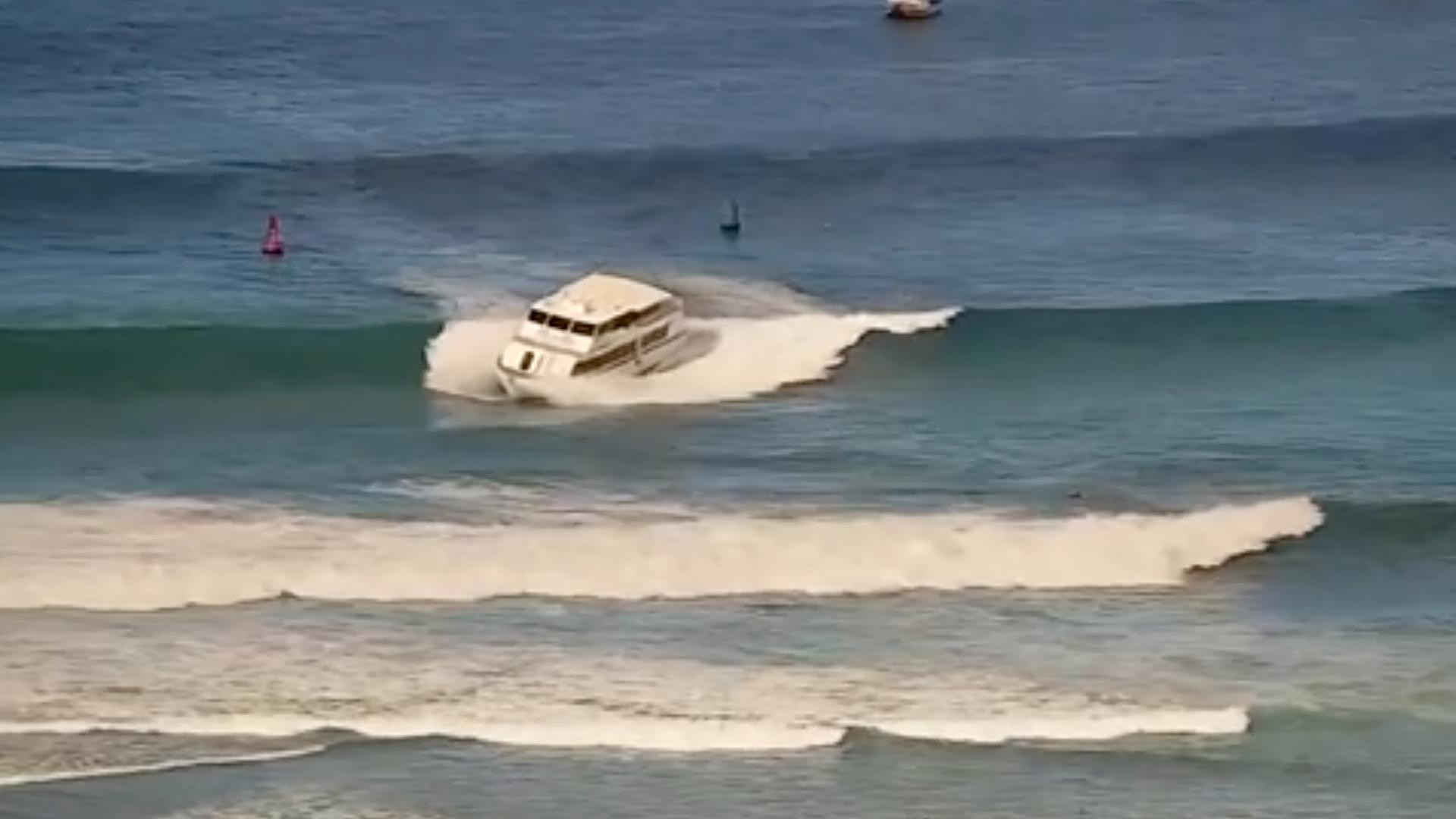 Passenger boat nearly flips in high surf before running aground | wltx.com