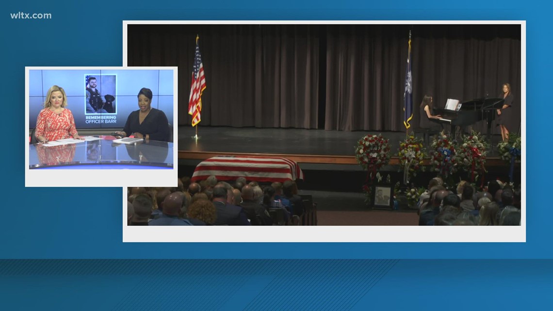 Locals gather for the motorcade of Officer Drew Barr as he made his way ...