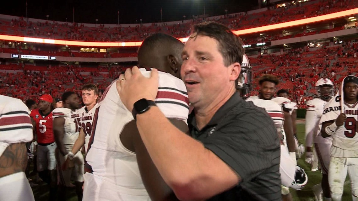 Gamecock players spend a few moments with their former head coach ...