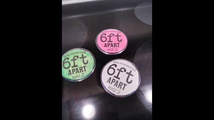 Midlands family makes social distancing reminders in button form | wltx.com